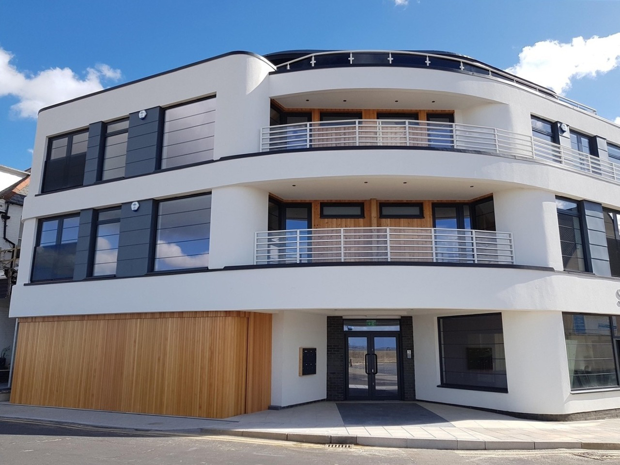 Side sliding garage door benefits stack up for parking lifts