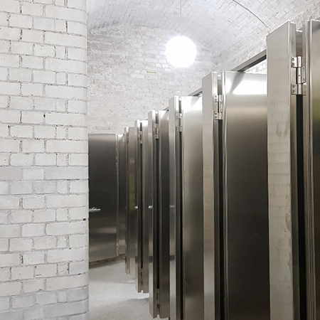 Brushed stainless steel cubicles at Royal Academy of Arts