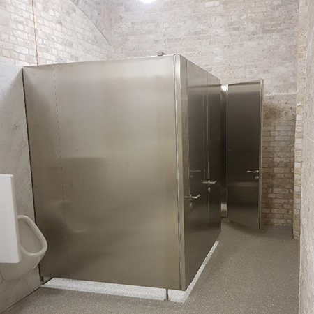 Brushed stainless steel cubicles at Royal Academy of Arts